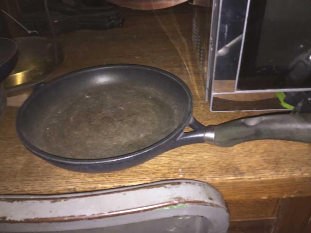 Black Metal Frying Pan With Black Plastic Handle